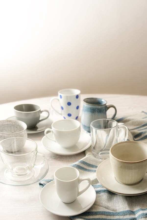 Several Different Empty Coffee and Tea Cups on a Round Table with a ...