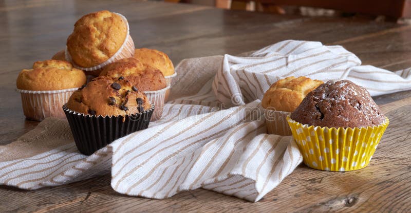 Several Different Muffins on a Wooden Table. Stock Photo - Image of ...