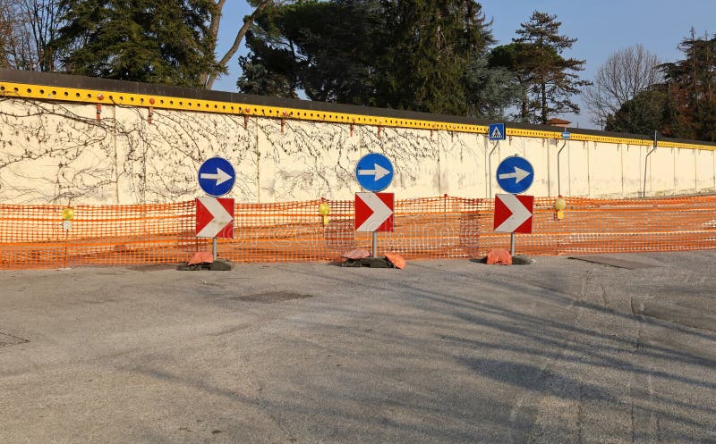 Several Directional Road Signs and Warning Lights in Front of Plastic ...