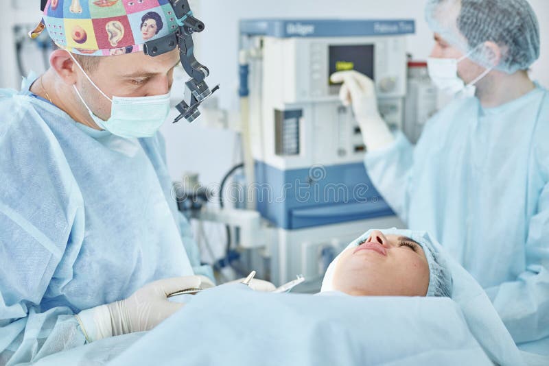 Several Doctors Surrounding Patient on Operation Table during T Stock ...
