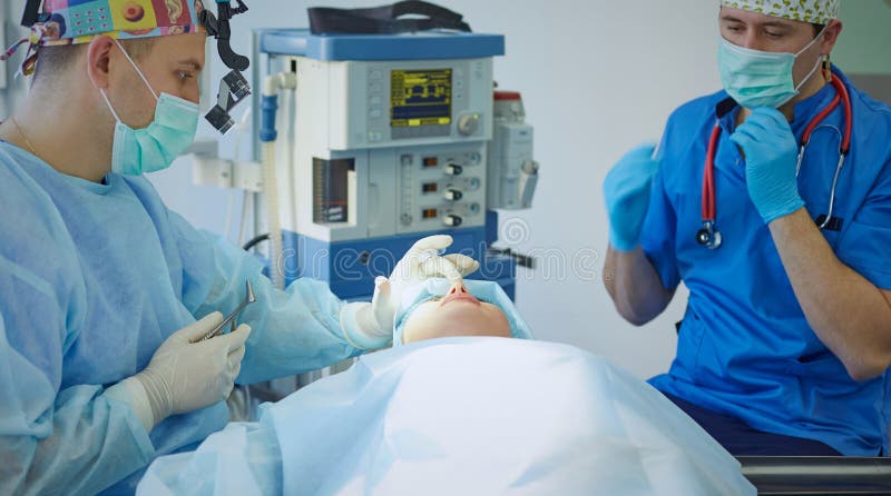 Several Doctors Surrounding Patient on Operation Table during T Stock ...