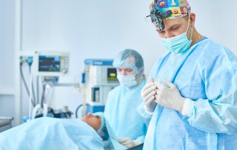 Several Doctors Surrounding Patient on Operation Table during Their ...