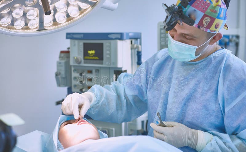 Several Doctors Surrounding Patient on Operation Table during T Stock ...