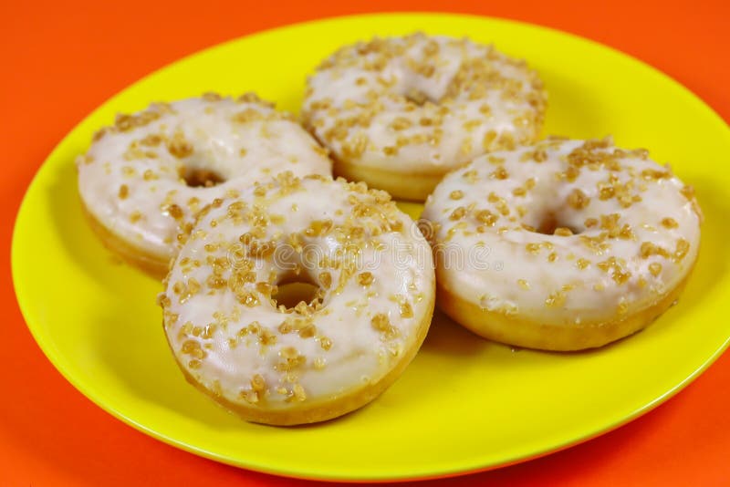 Donuts on a plate stock photo. Image of united, donuts - 178680230