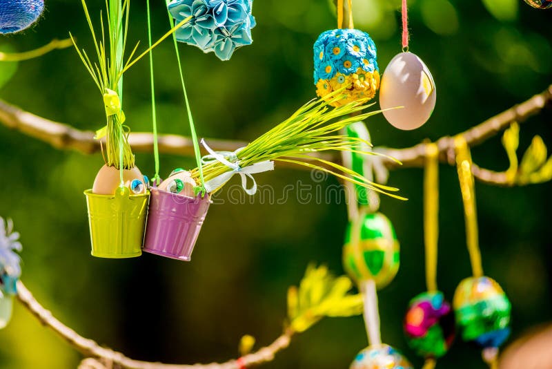 Several Easter Colored Eggs Hanging on a Tree Branch Stock Photo ...