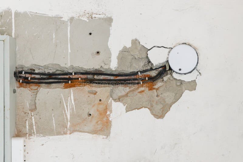 Several Electrical Cables are Routed in the Damaged Wall Stock Photo ...