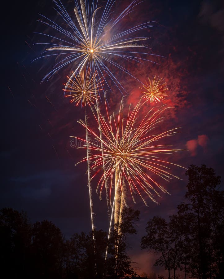 Several Exploding Fireworks in the Evening Sky Stock Photo - Image of ...