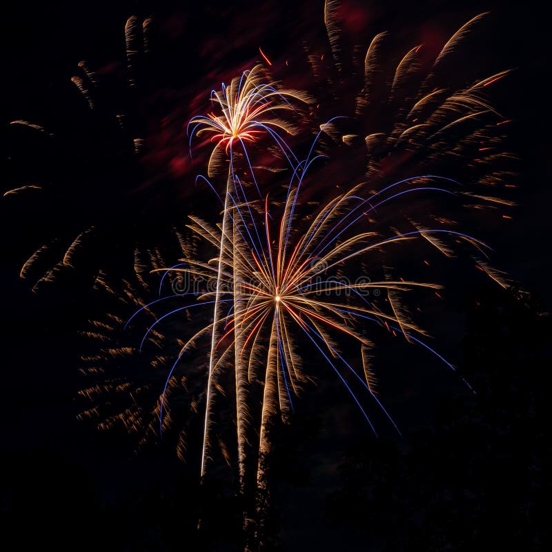 Several Exploding Fireworks in the Evening Sky Stock Photo - Image of ...