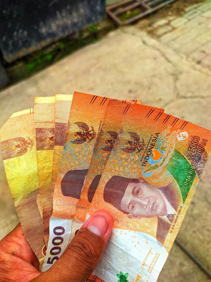 Several Five Thousand Rupiah Notes in Hand Stock Photo - Image of ...