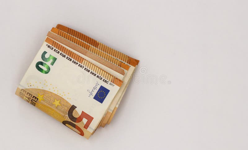 Several Folded 50 Euro Banknotes on a White Background. Free Space for ...