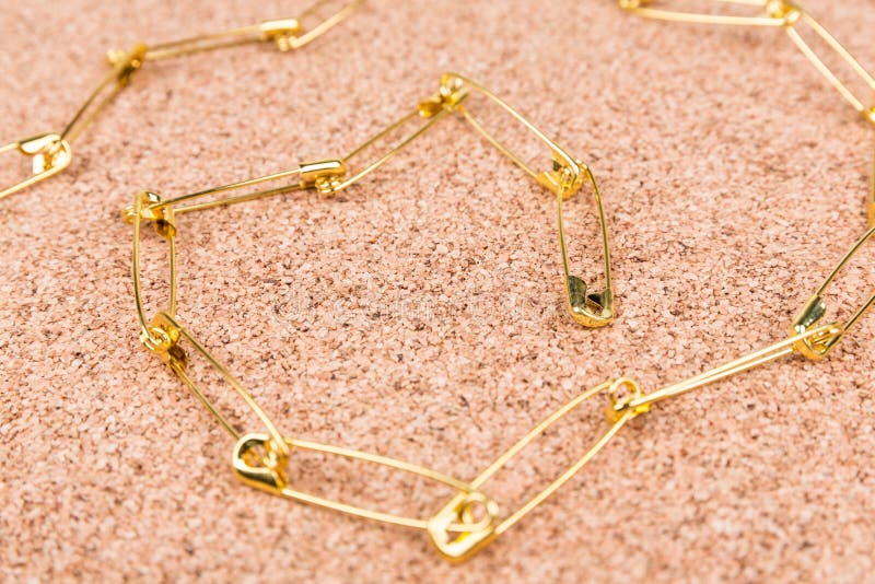 Several Gold Safety Pins Chained Stock Photo - Image of shiny ...