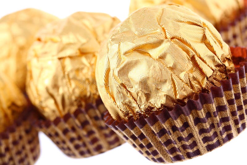 Several Golden Luxury Sweets Isolated on White Stock Photo - Image of ...