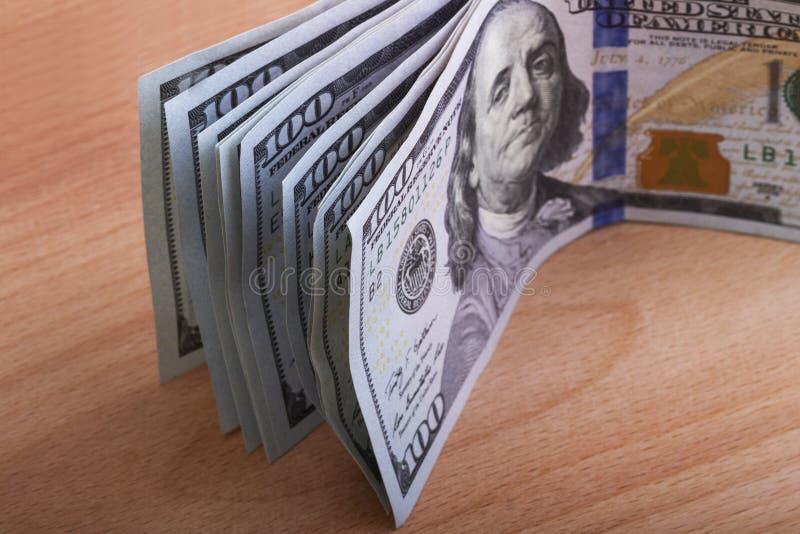 Several Hundred-dollar Bills on the Table Stock Photo - Image of ...