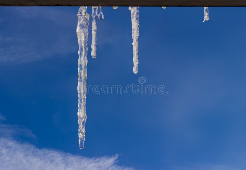 Several Icicles on Background of Sky Stock Photo - Image of water ...