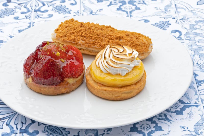 Several Individual Pastries on a Plate Stock Photo - Image of fruit ...