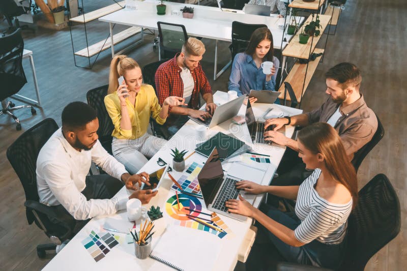 Group of People Working on Laptops at Table Stock Photo - Image of ...