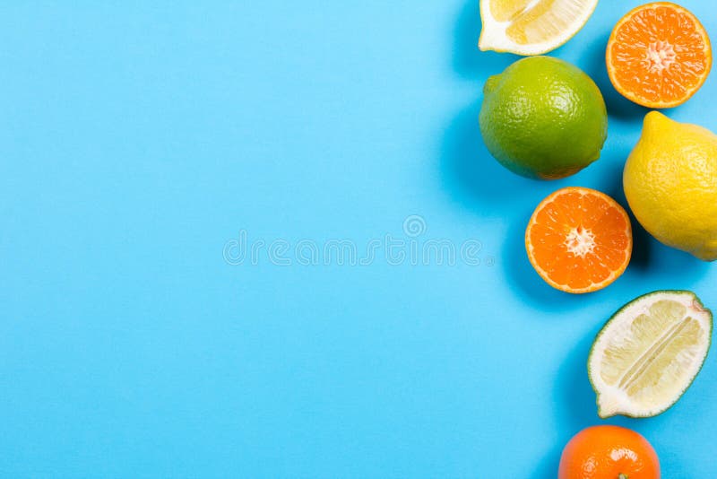 Several Kinds of Whole and Cut Citrus on a Blue Background Stock Image ...