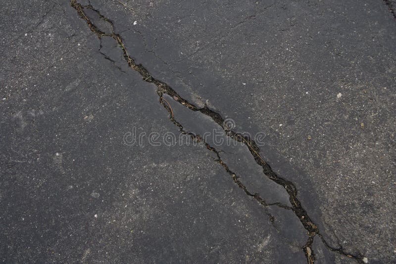 Dominating Large Diagonal Cracks in Dark Pavement Stock Photo - Image ...