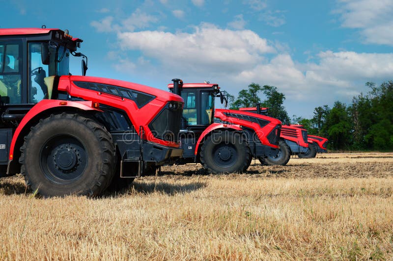 Several Large Modern Red Tractors Standing in a Field Stock Image ...
