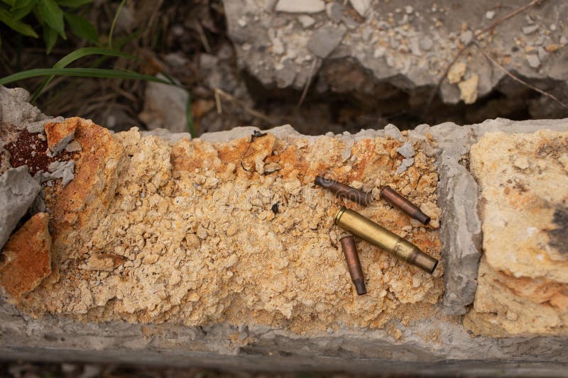 Several Large and Small Shell Casings Lie on Part of the Destroyed ...