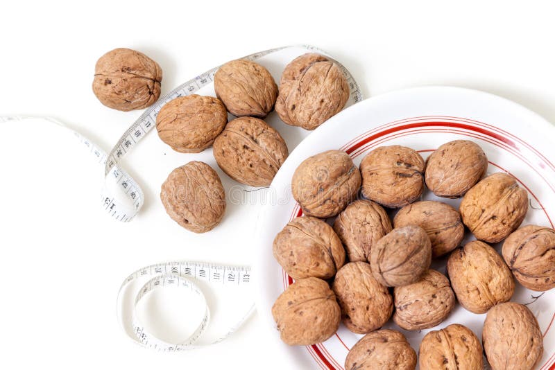 Several Large Walnuts Lie on Plate and Next To Each Other. Stock Photo ...