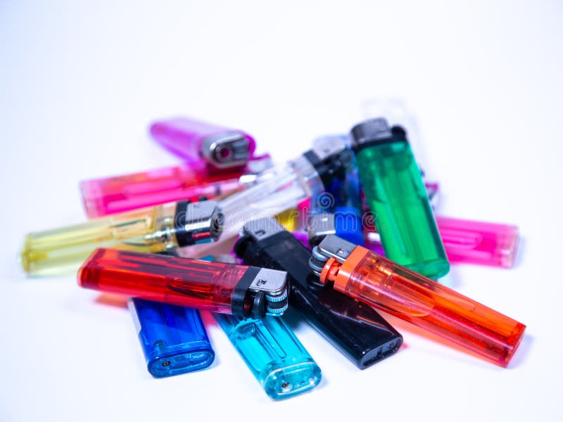 Several Lighters in Different Colors Lying Mixed Up with Focus on the ...