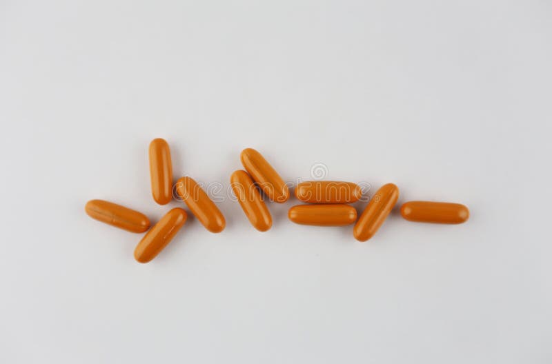 Several Long Orange Colored Tablets. Stock Photo - Image of banded ...