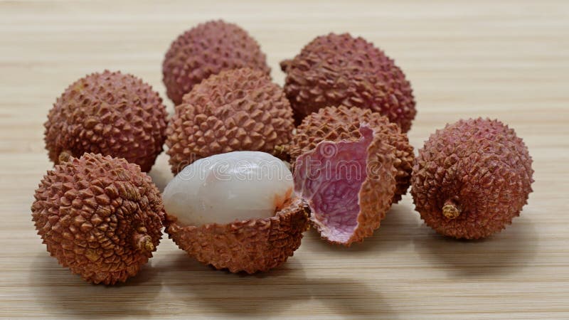 Several Lychee Fruits, One with Open Peel Stock Image - Image of lechee ...