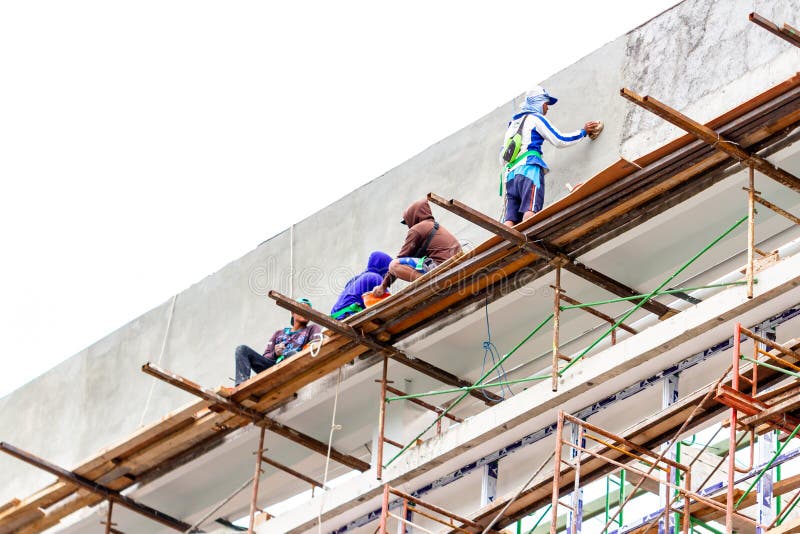 Several Male Workers on the Construction of a High-rise Building Around ...