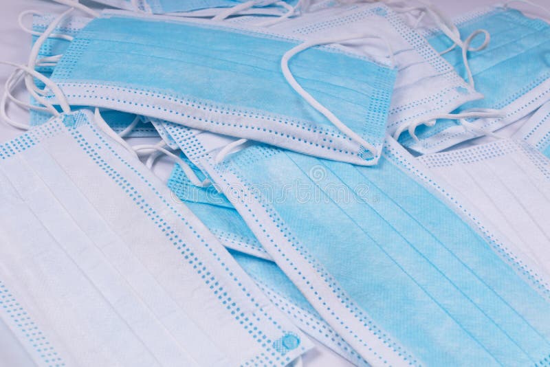 Several Masks Lie on Top of the Pile with the Blue Side Up, and One ...