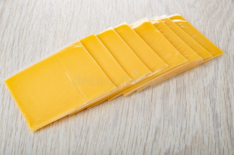 Several Packages of Cheese on Table Stock Photo - Image of close, table ...