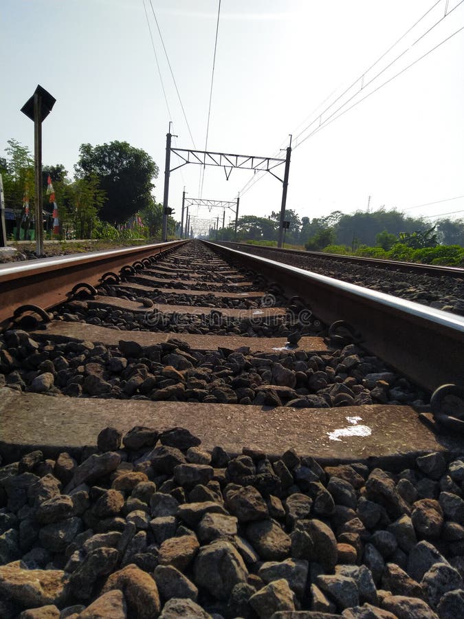 Several Piles of Stone Lining the Railroad Tracks Stock Image - Image ...