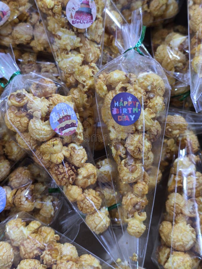 Several Plastic Bags Filled with Fresh Popcorn, Highlighting the Light ...