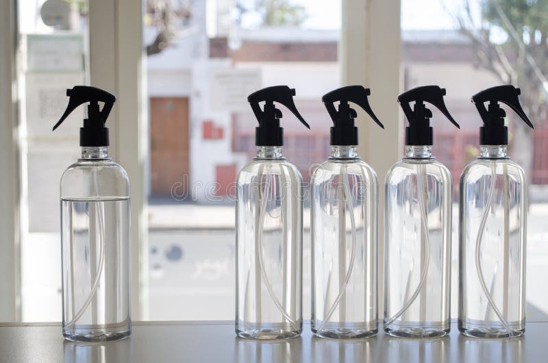 Several Plastic Spray Bottles Lined Up and a Separate One Stock Image ...