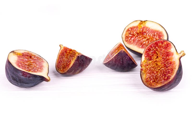 Several Ripe Fig Slices on White Surface Front View Stock Photo - Image ...