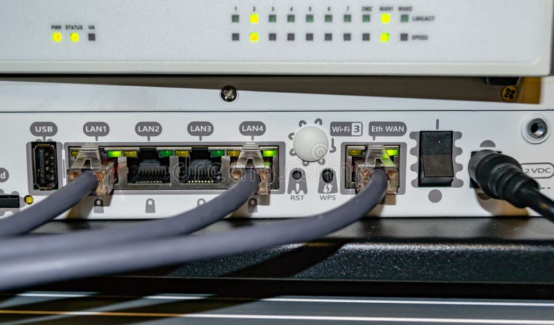 Several RJ45 Ethernet Cables Plugged into a Switch Inside a Server Rack ...