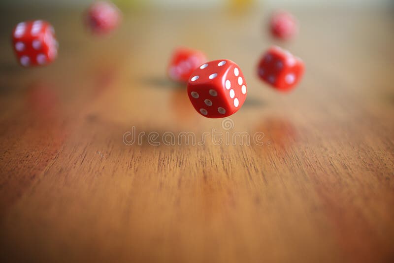 Several Rolling Red Dice Fall on a Table Stock Image - Image of motion ...