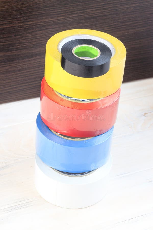 . Several Rolls of Adhesive Tape are Stacked. Stack of Electrical Tape ...
