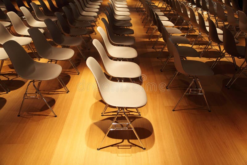 Several Rows of Plastic Chairs Stock Image - Image of legs, bright ...