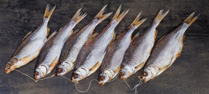 Several Salted and Dried Roach on Black Surface, Top View Stock Image ...