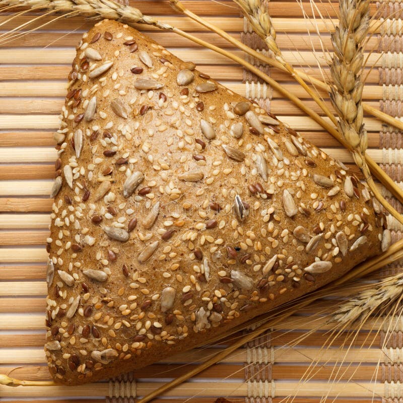 Several Small Multi Grain Triangular Shaped Bread Sprinkled with Whole ...