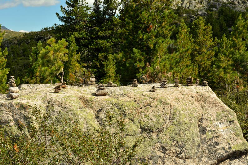 Several Small Stone Pyramids Stacked on a Large Flat Stone Against the ...