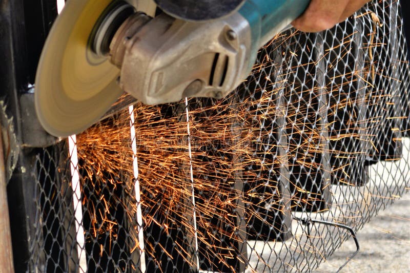 Several Sparks of Fire from the Grinder on the Iron Gate Stock Photo ...