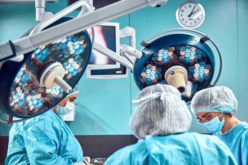 Several Surgeons Surrounding Patient on Operation Table during Their ...