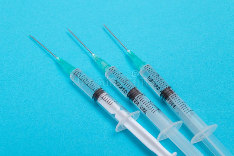 Several Syringe on Blue Table Stock Photo - Image of medical, chemistry ...