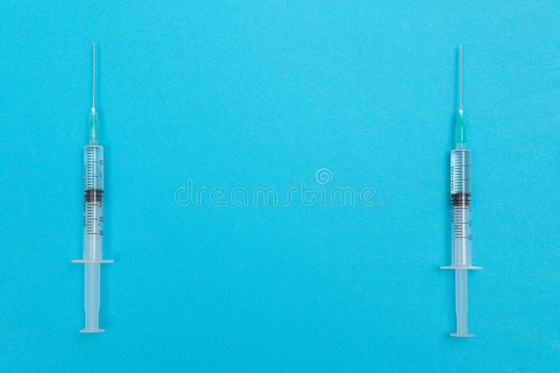 Several Syringe on Blue Table Stock Photo - Image of alert, needle ...