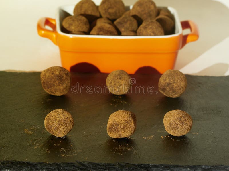 Tasty Several Truffles in a Rectangular Shape on Black Slate Board ...