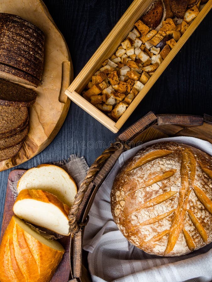 Several Types of Fresh Bread and Crackers Lying on an Wooden Table ...