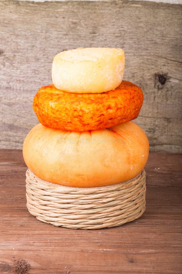 Several Varieties of Cheese on an Old Wooden Table Stock Photo - Image ...