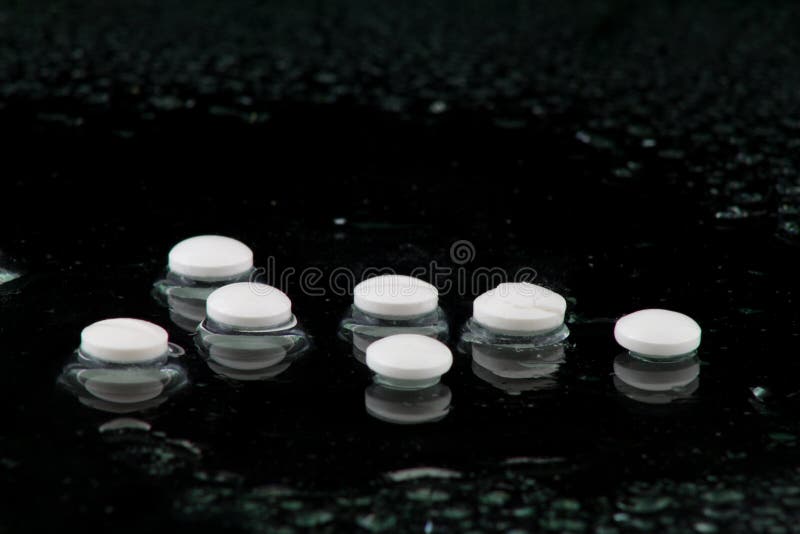 Several white tablets stock image. Image of black, industry - 68486995